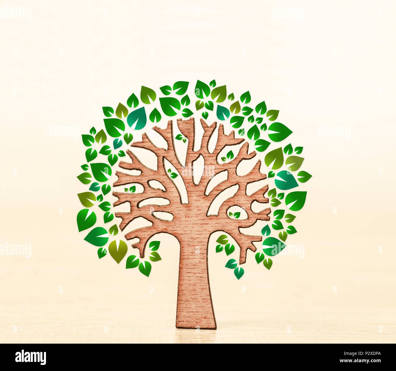 Eco friendly tree with green wooden leaves Stock Photo - Alamy