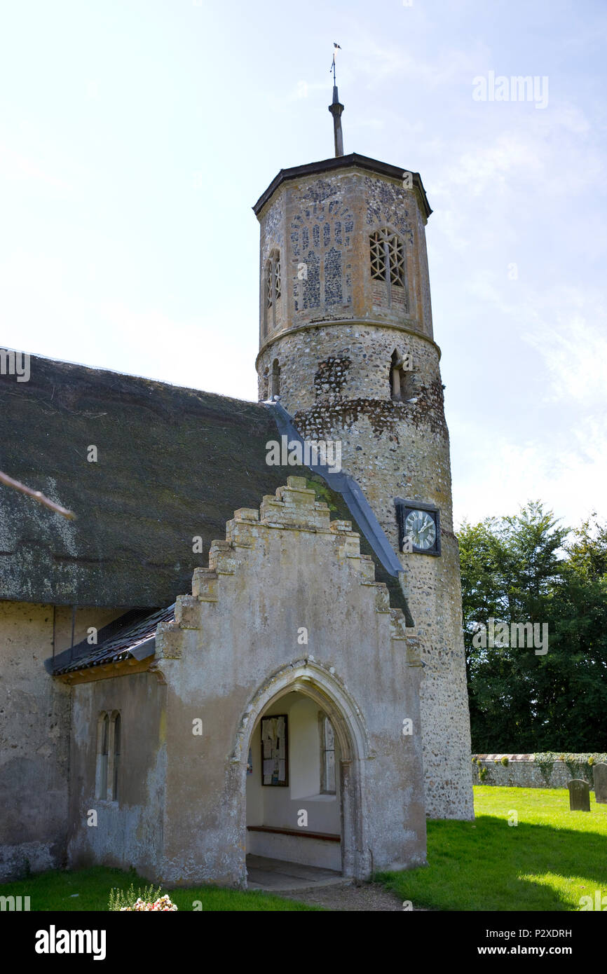 St Mary the Virgin Church, with its octagonal tower and thatched roof ...