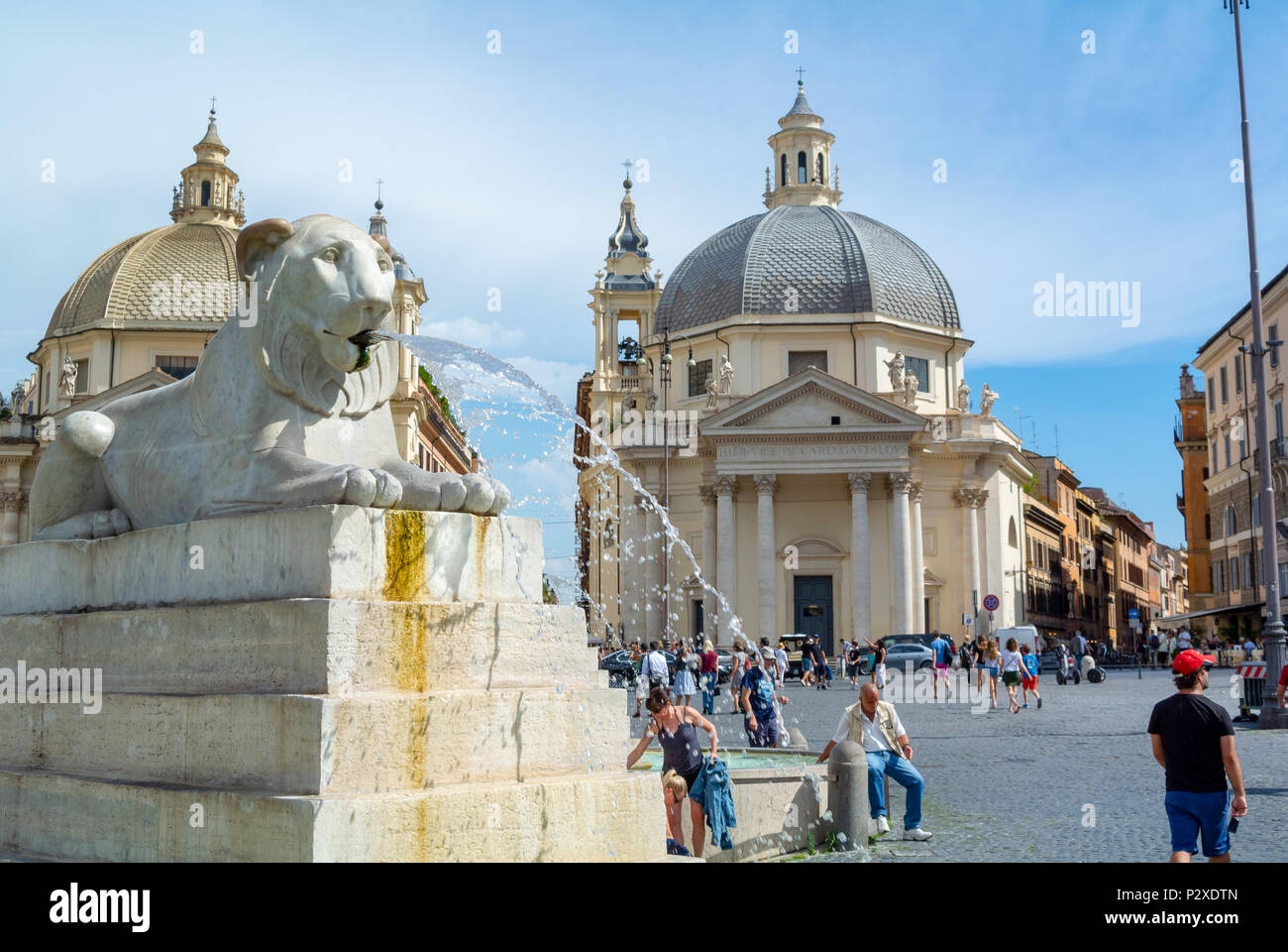 Tourists by the Santa Maria dei Miracoli church and Santa Maria in ...