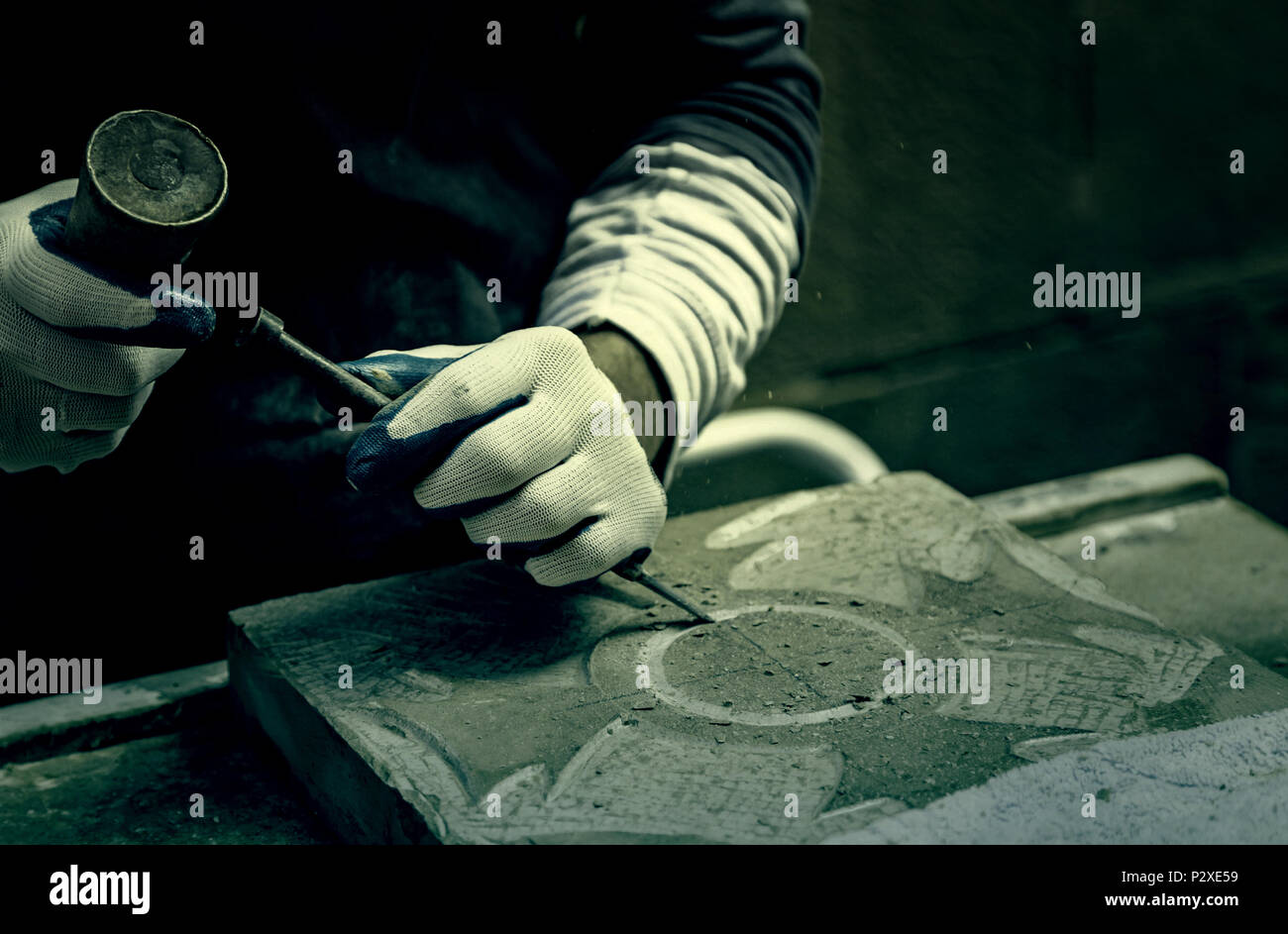 Man carving stone detail of a traditional craftsman working stone ...