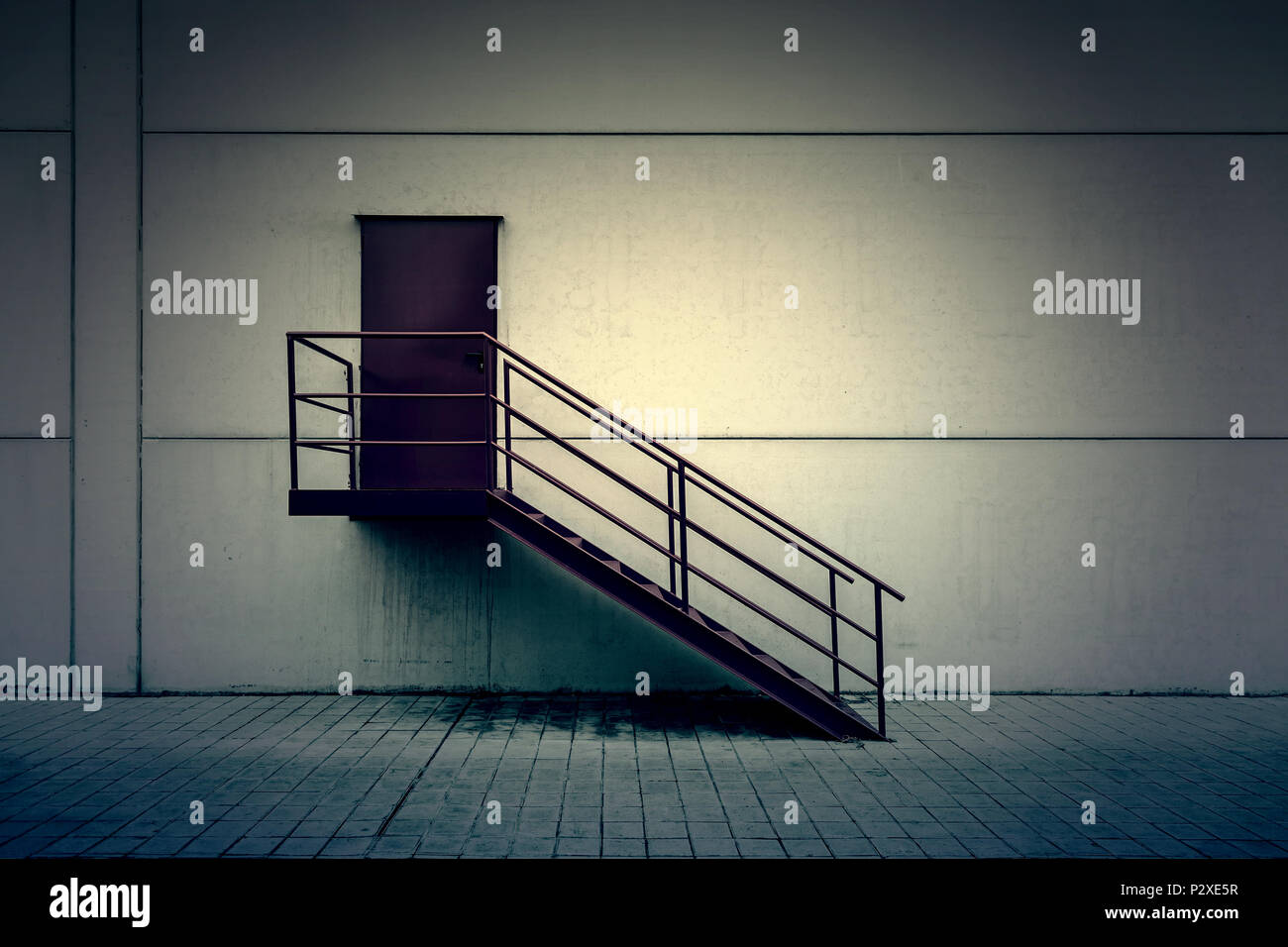 Red metal staircase on the outside, detail of a red painted ladder ...