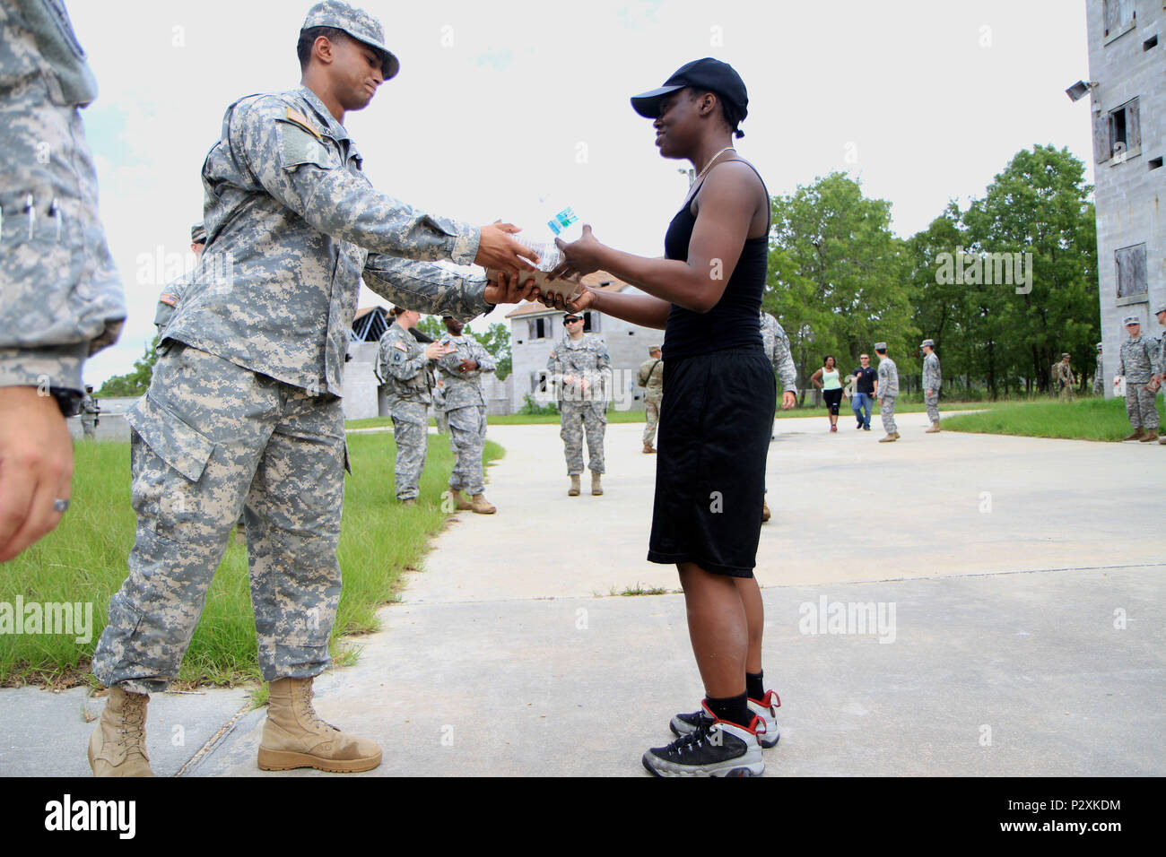 STARKE, Fla. - Soldiers hand out meal packages to roleplayers at the ...