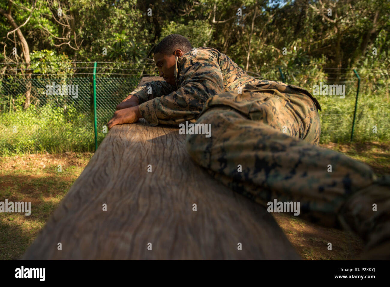 Cpl. Jordan M. Pride, a rifleman, climbs over an obstacle in the French ...