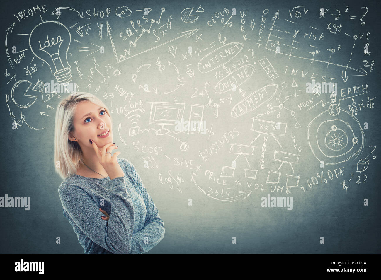 Portrait of thoughtful young woman looking up and imagining, has many ...