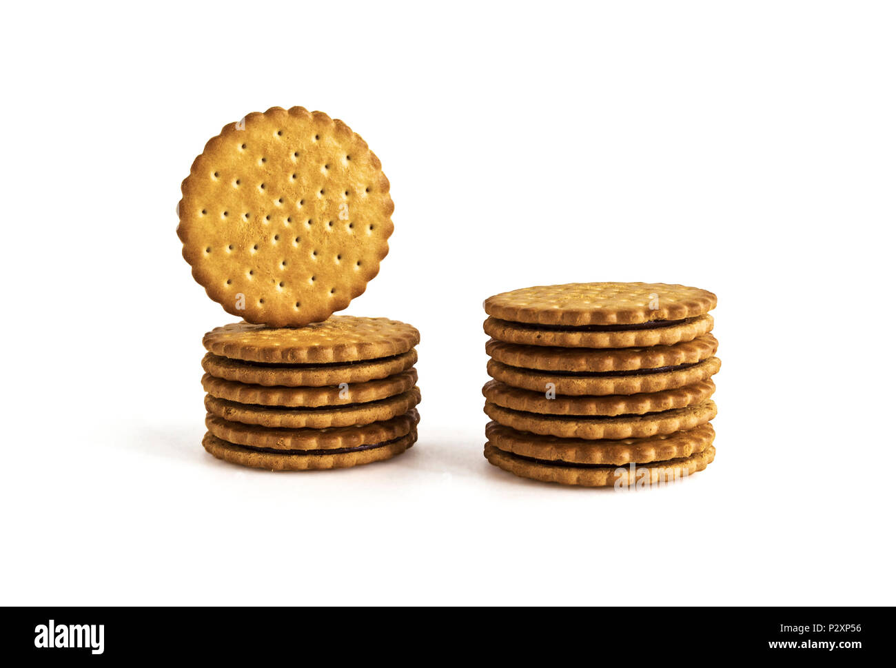 two stacks of cookies on white background Stock Photo - Alamy