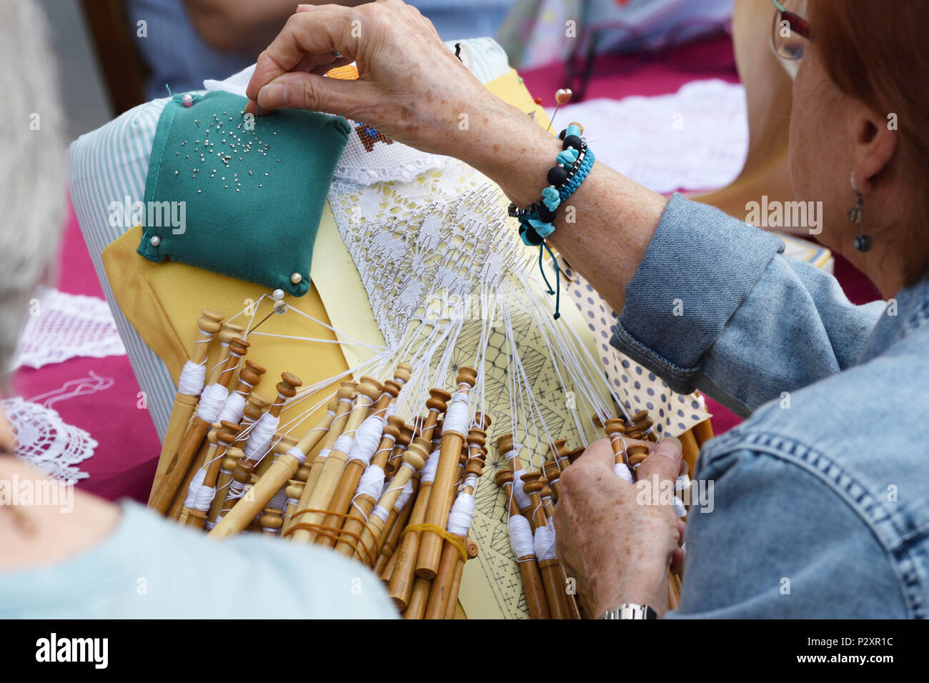 Active senior people workshop with traditional bobbin lace crochet ...