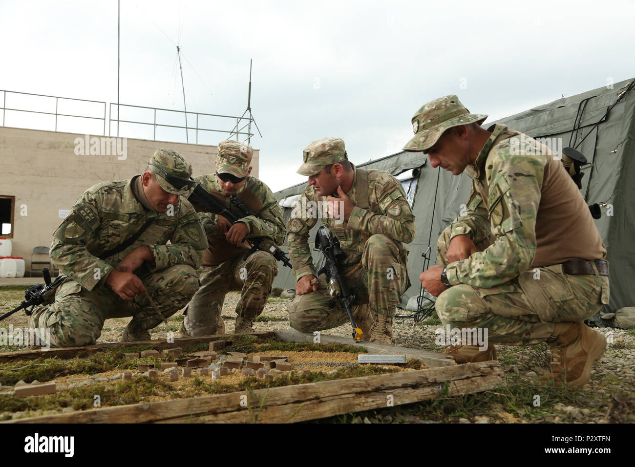 Georgian soldiers of the 32nd Infantry Battalion discuss tactical ...
