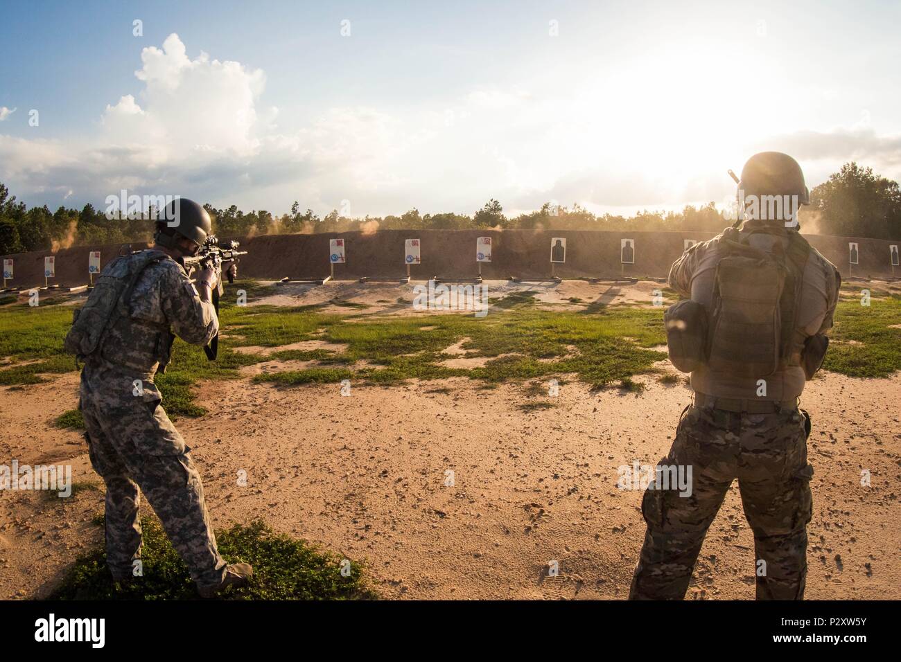 A U.S. Army soldier shoots while the other soldier both from Foxtrot ...