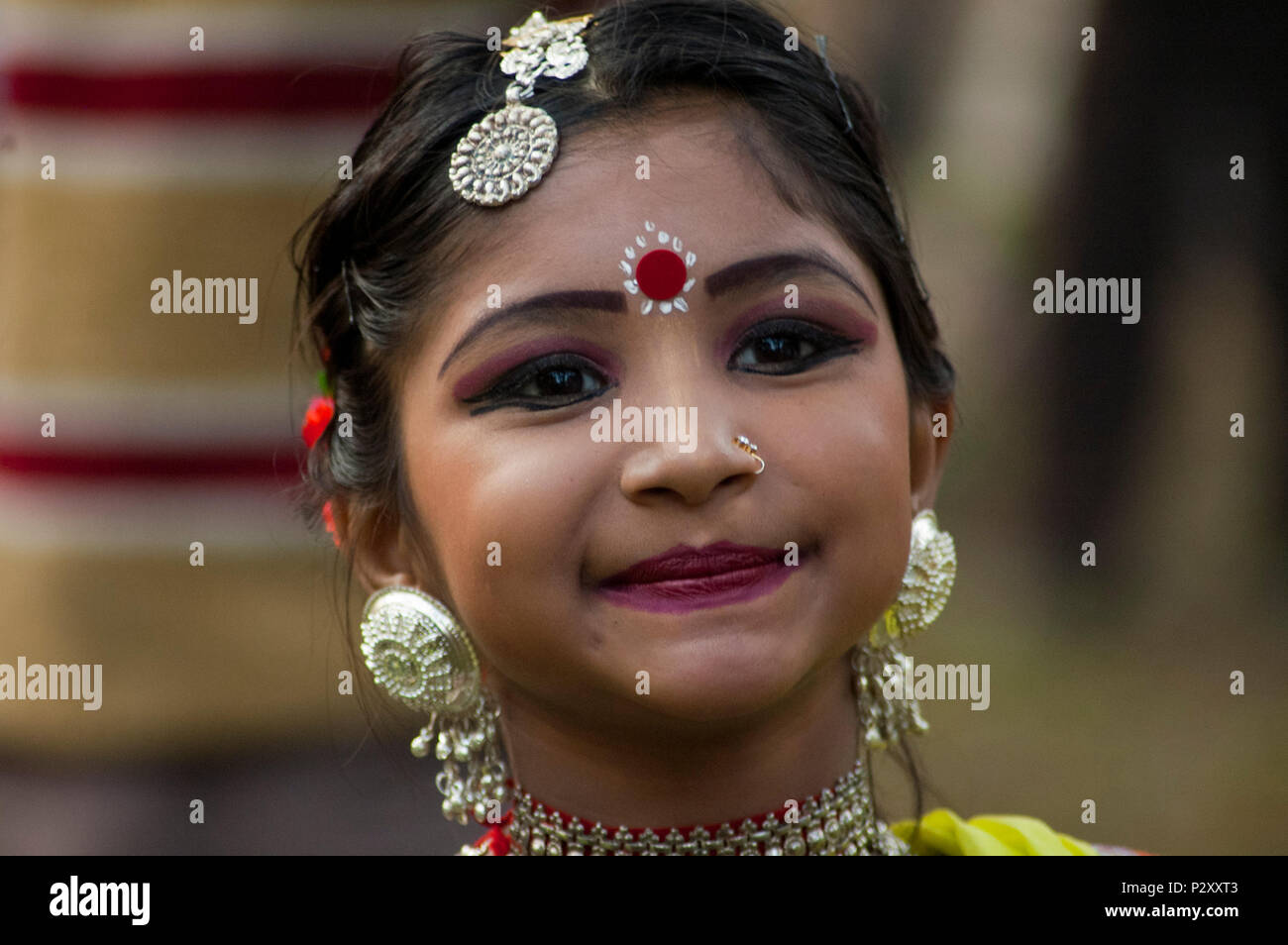 Girl wears traditional costume at Poush Mela 1414 and celebrating ...