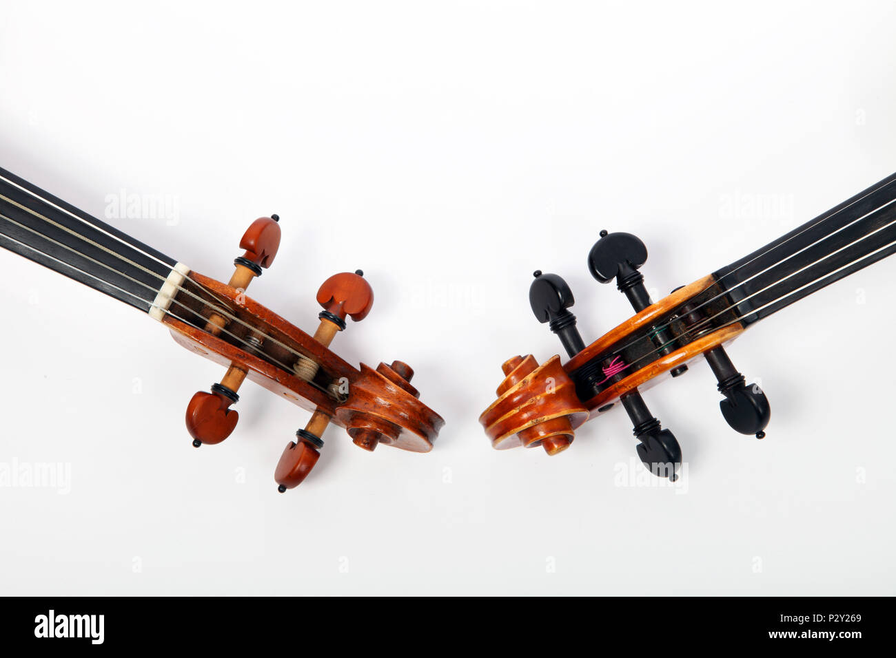 two violin necks and scrolls Stock Photo - Alamy