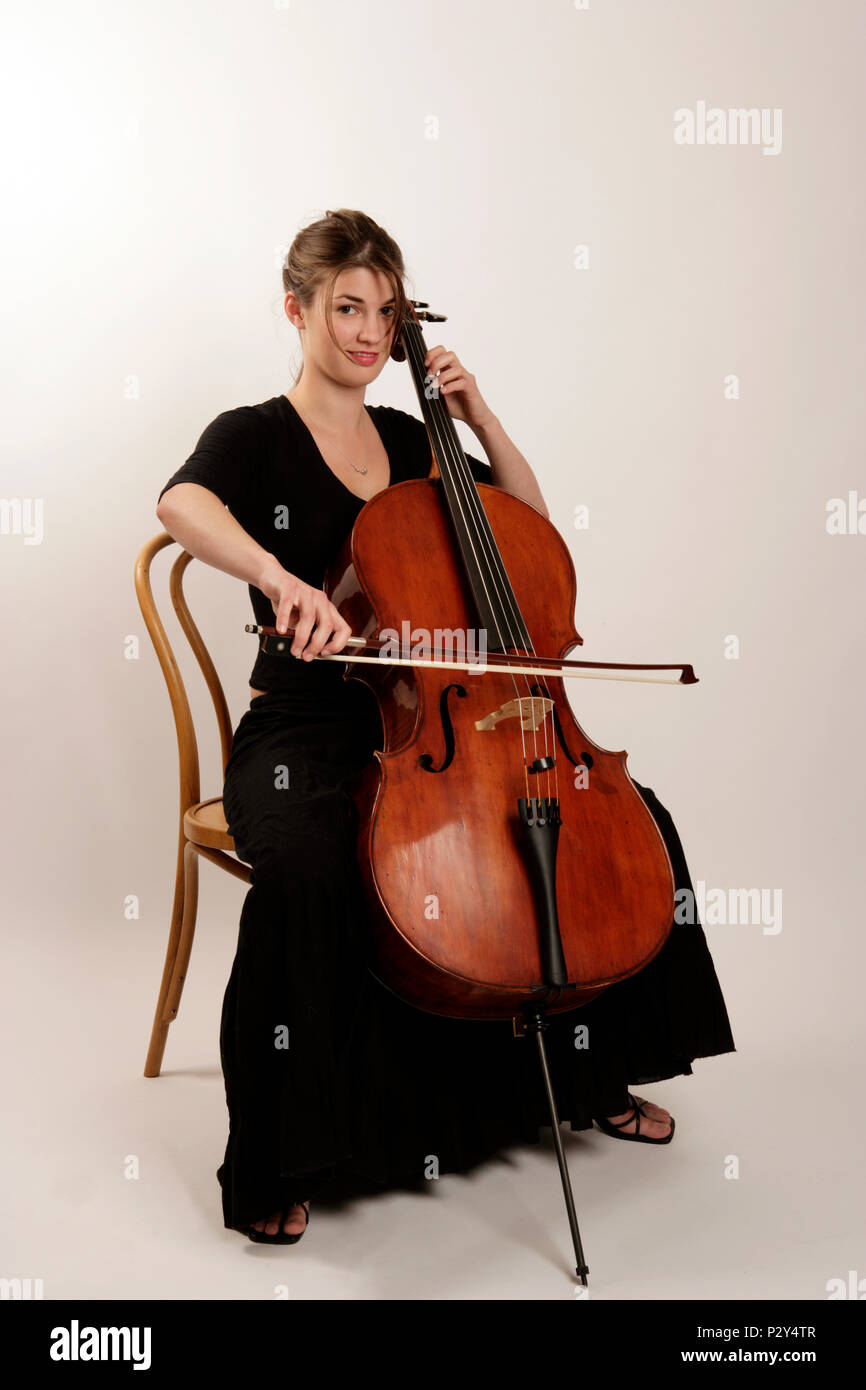Young woman/student in concert dress, playing the cello Stock Photo - Alamy