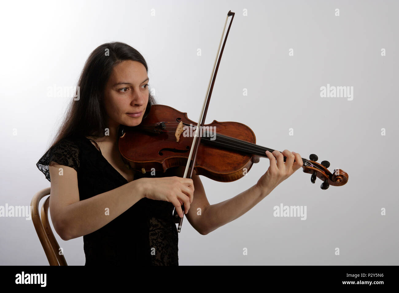 Generic - Viola player playing with the bow Stock Photo - Alamy