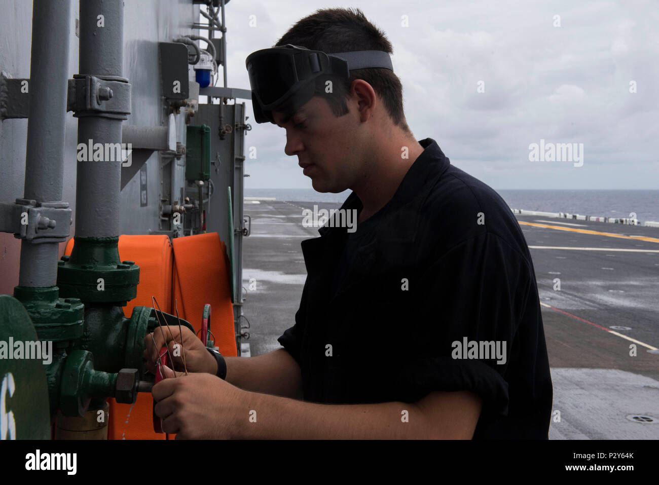 180807-N-NB544-003 EAST CHINA SEA (Aug. 7,2016) Fireman Austin Tucker ...