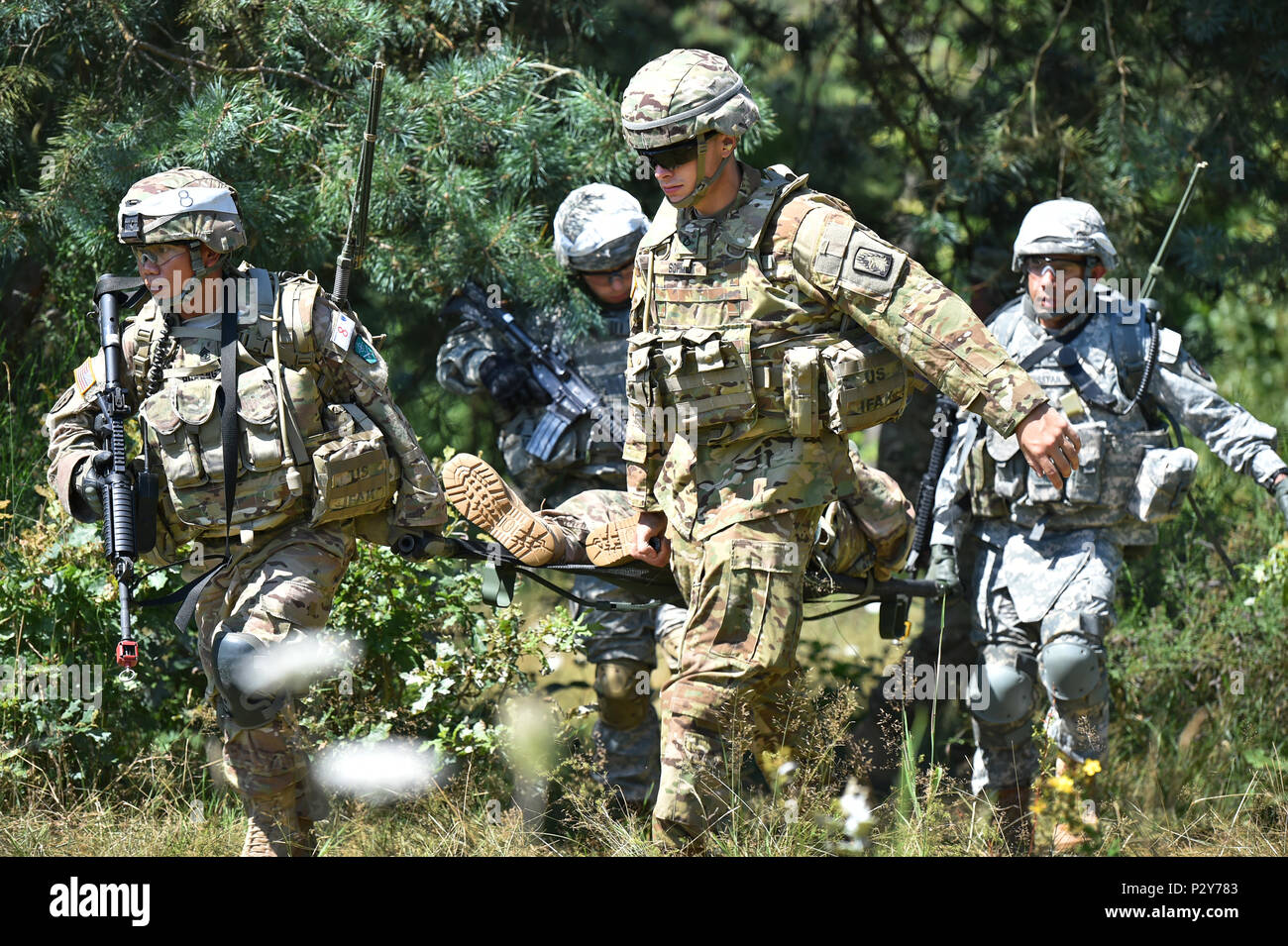 GRAFENWOEHR, Germany -- Sgt. 1st Class Dominador Rubang (left) of U.S ...
