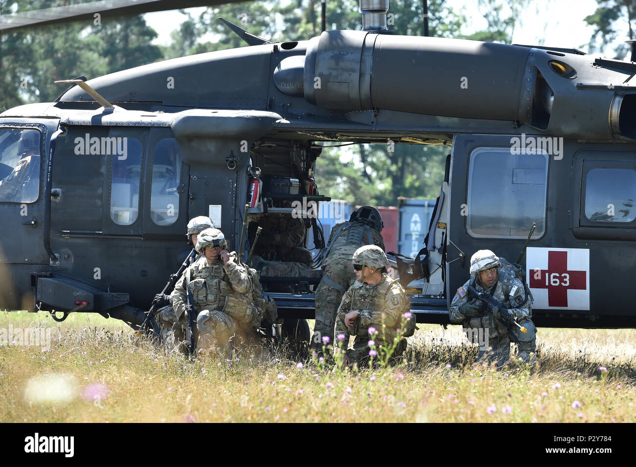GRAFENWOEHR, Germany -- Staff Sgt. Jeremiah Steele (background left) of ...