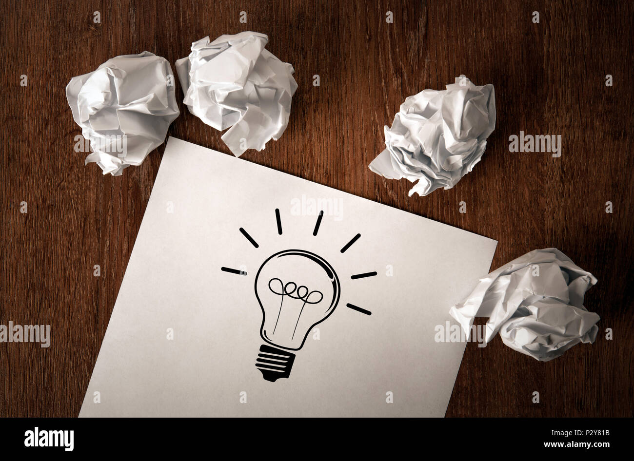 still life of paper and a crumpled paper on a table with an sign of ...