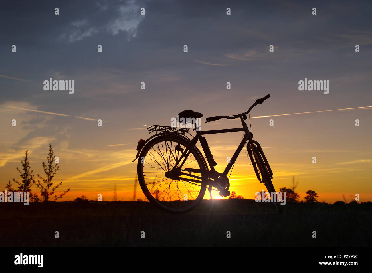 Bicycle silhouette - retro bike with sunset sky in background. Healthy ...
