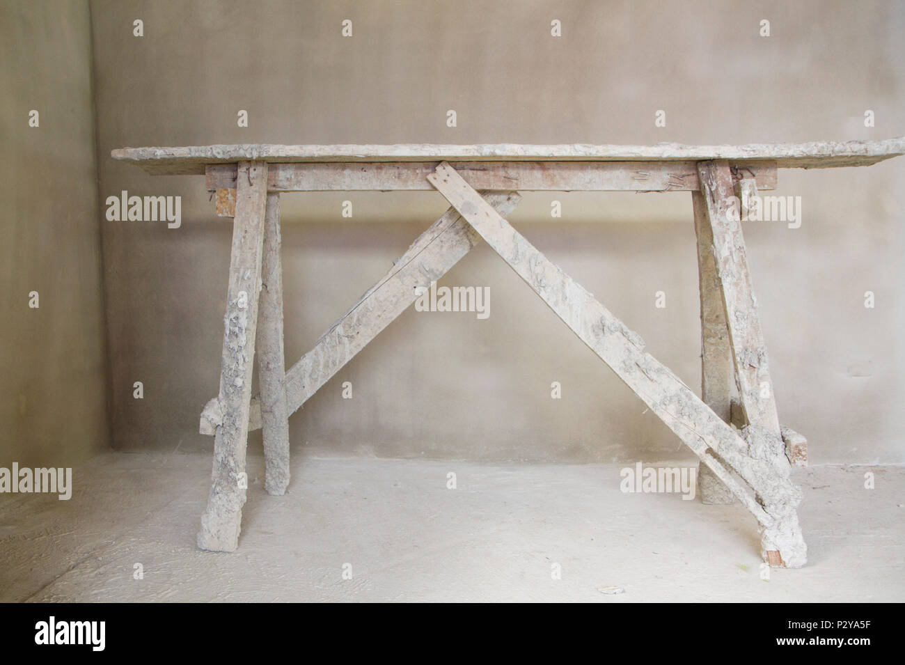 Dirty wooden table in empty room at construction site Stock Photo - Alamy