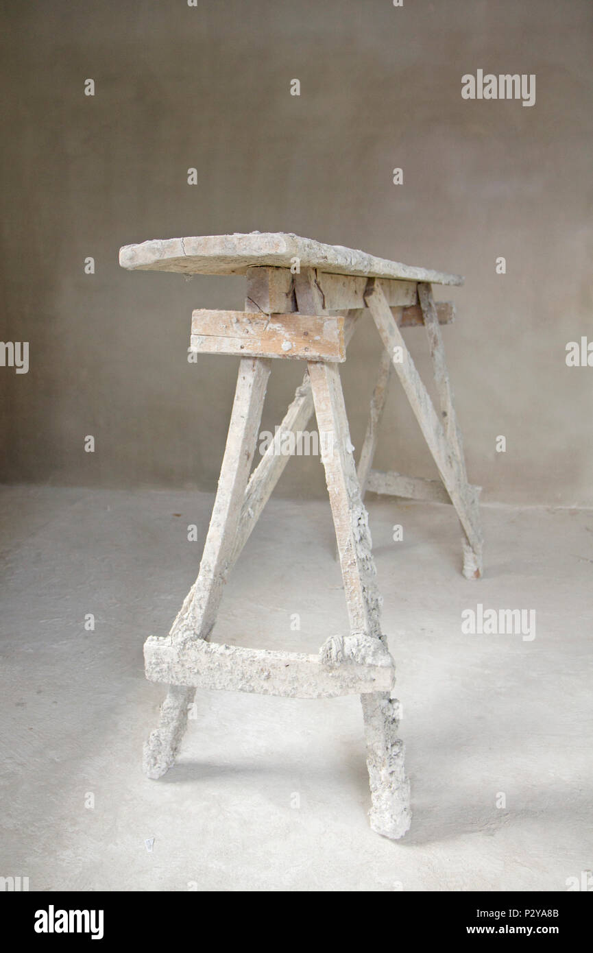 Dirty wooden table in empty room at construction site Stock Photo - Alamy