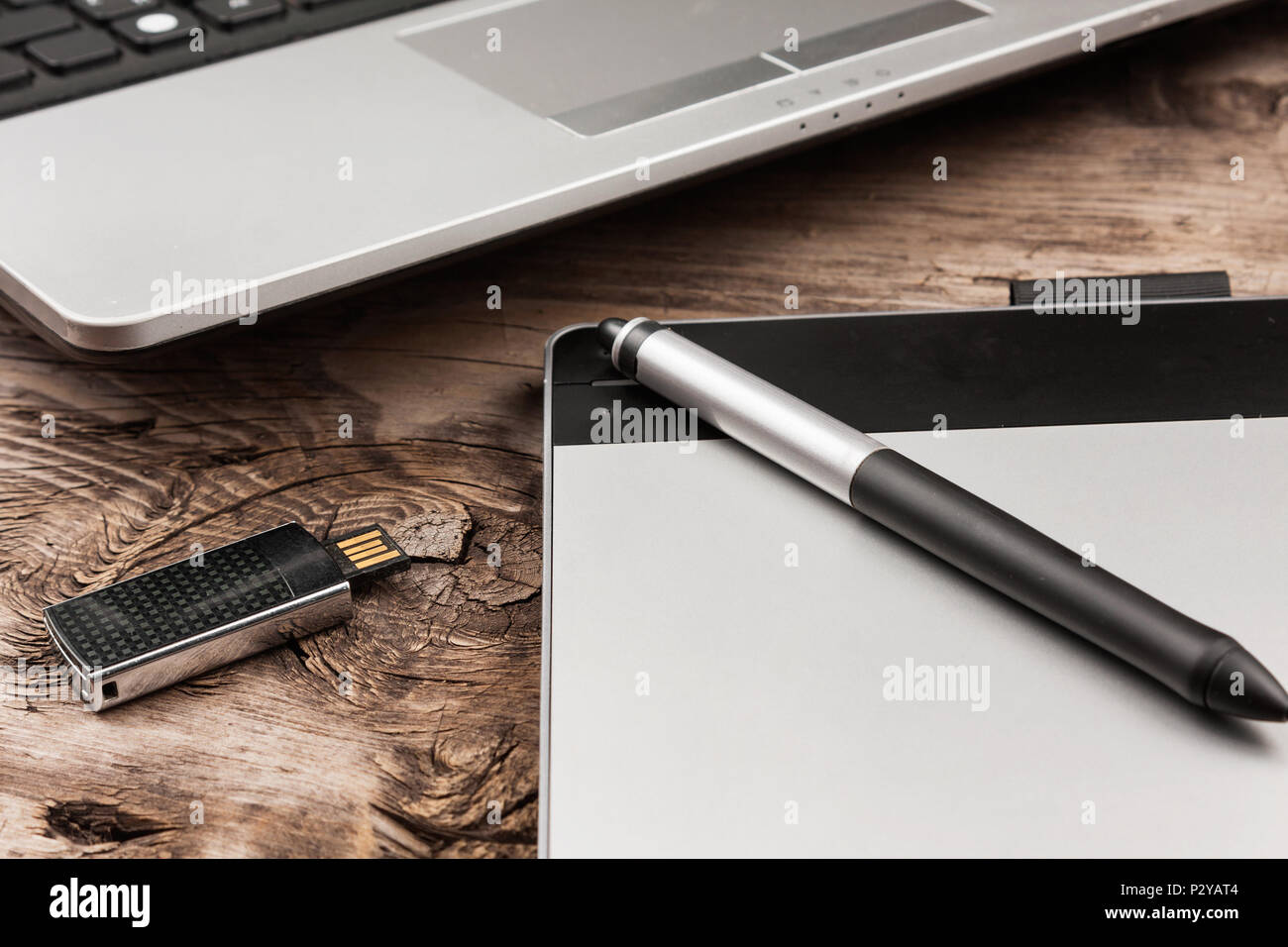 Close-up flash drive on the desktop. Work in office. View from above ...