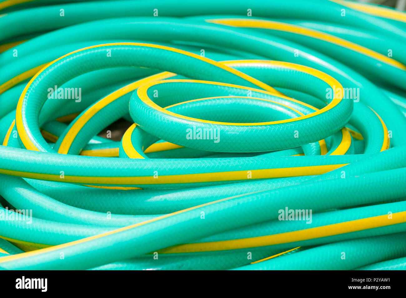 Green water rubber tube Stock Photo - Alamy