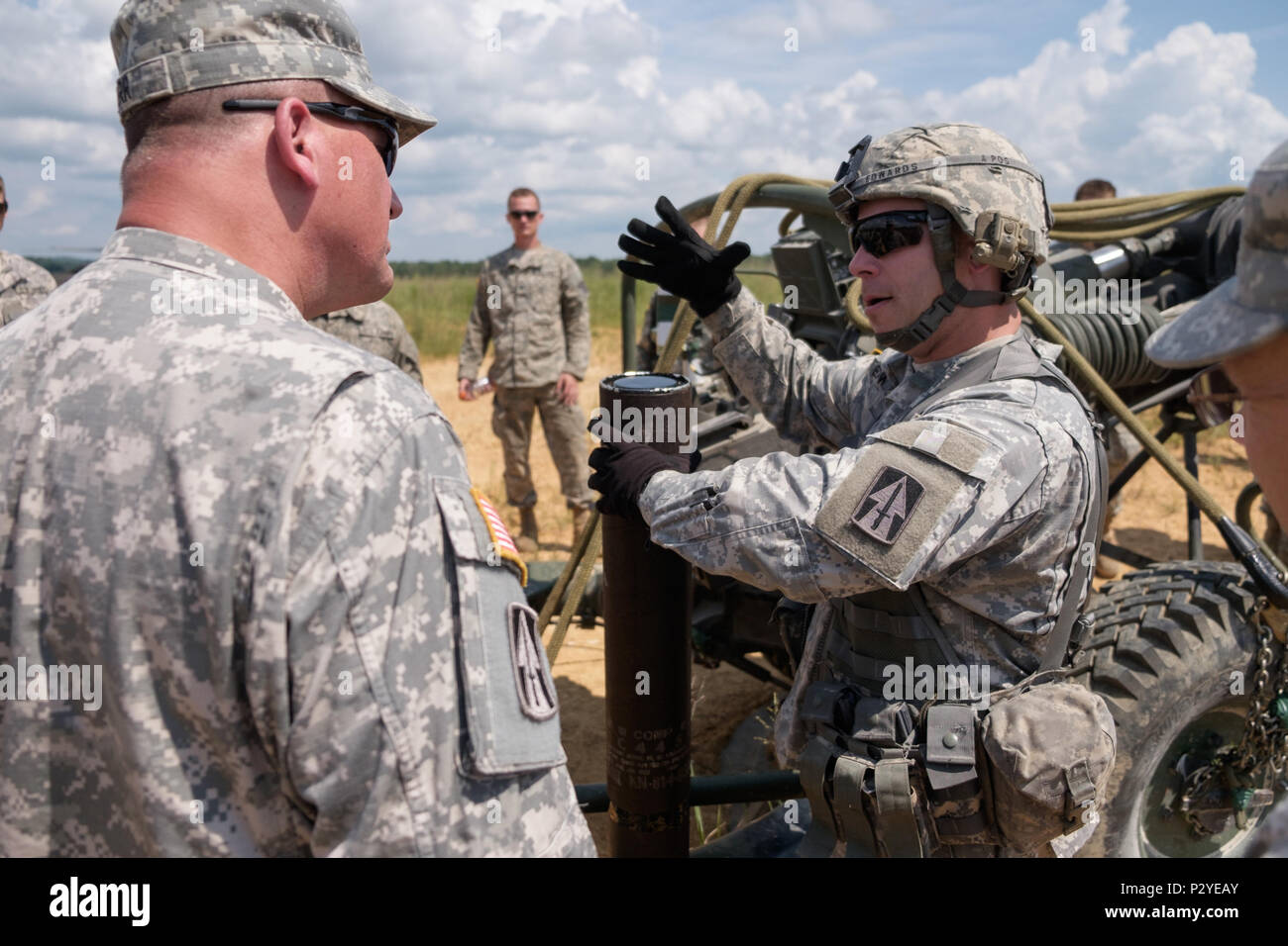 1-163rd Field Artillery Command Sgt. Major Edwards explains the M119 ...