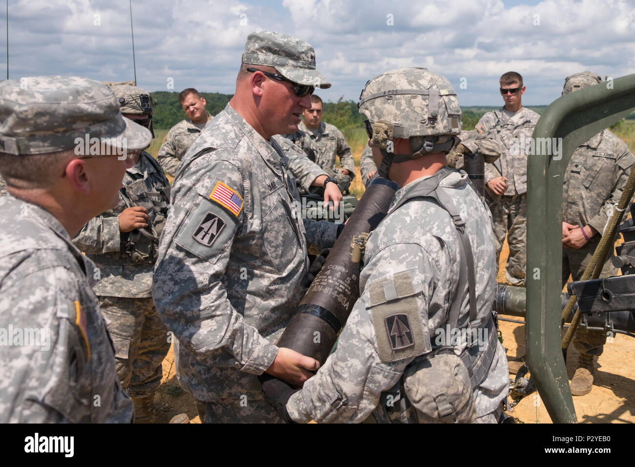 1-163rd Field Artillery Command Sgt. Major Edwards explains the M119 ...