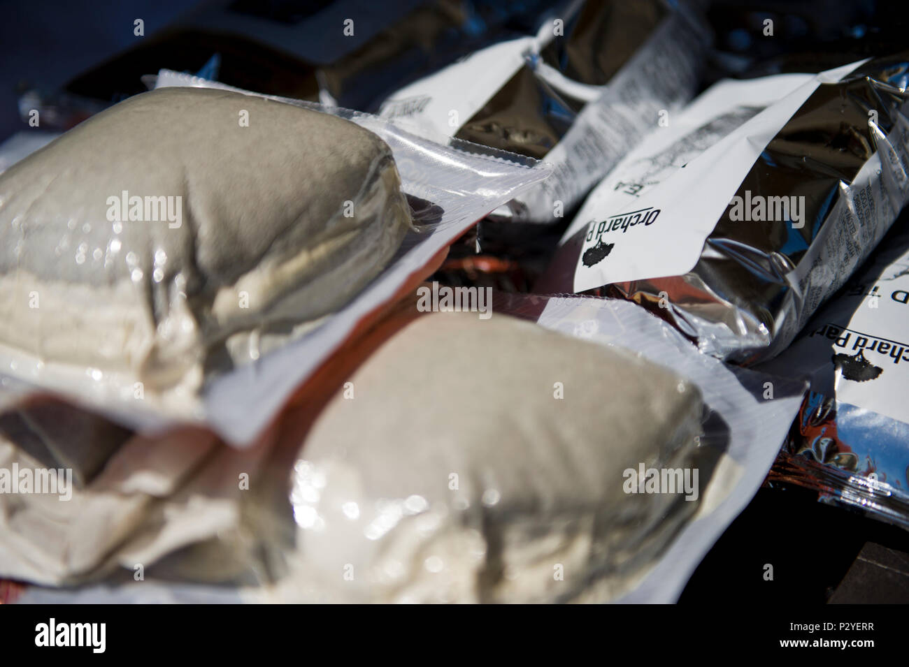 Components of unitized group rations are stacked in preparation for the ...