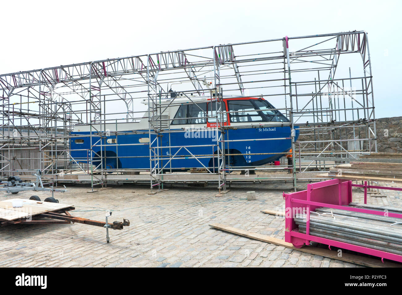 Scaffolding frame to support a tent being erected over an amphibious ...