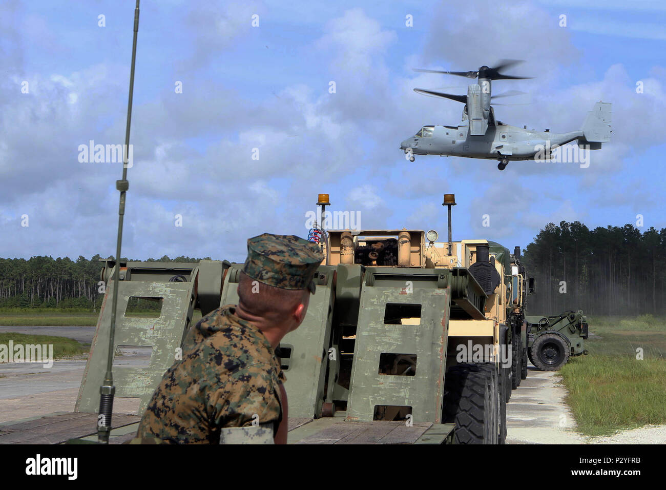 A Bell Boeing V-22 Osprey lands during an air drop training exercise at ...