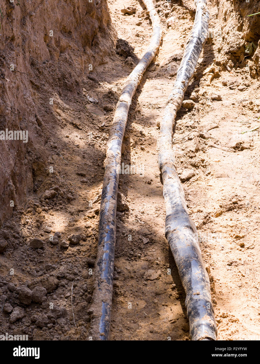 pipes in the construction pit. background, working Stock Photo - Alamy