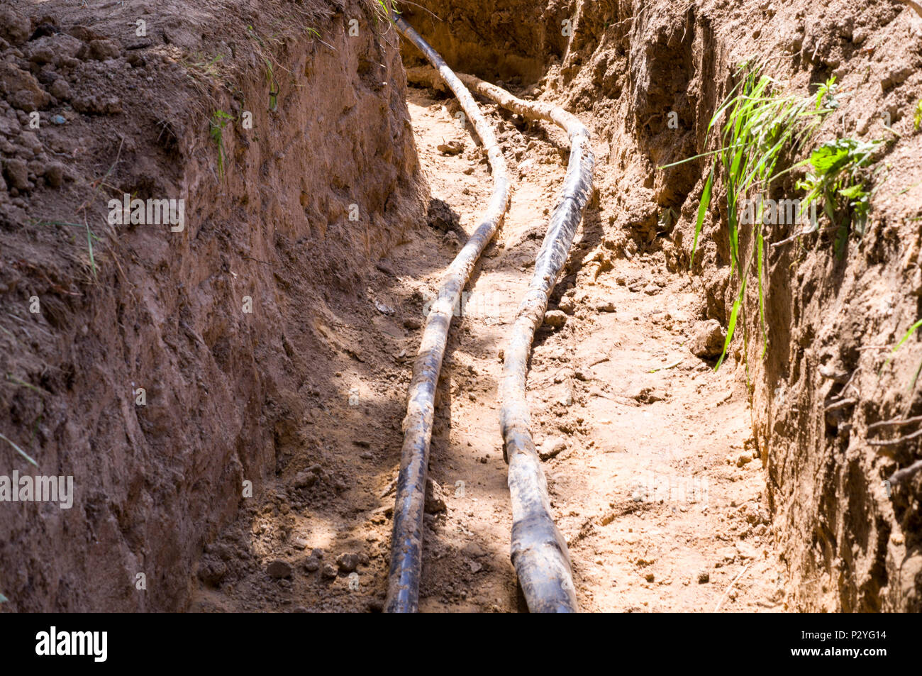 pipes in the construction pit. background, working Stock Photo - Alamy