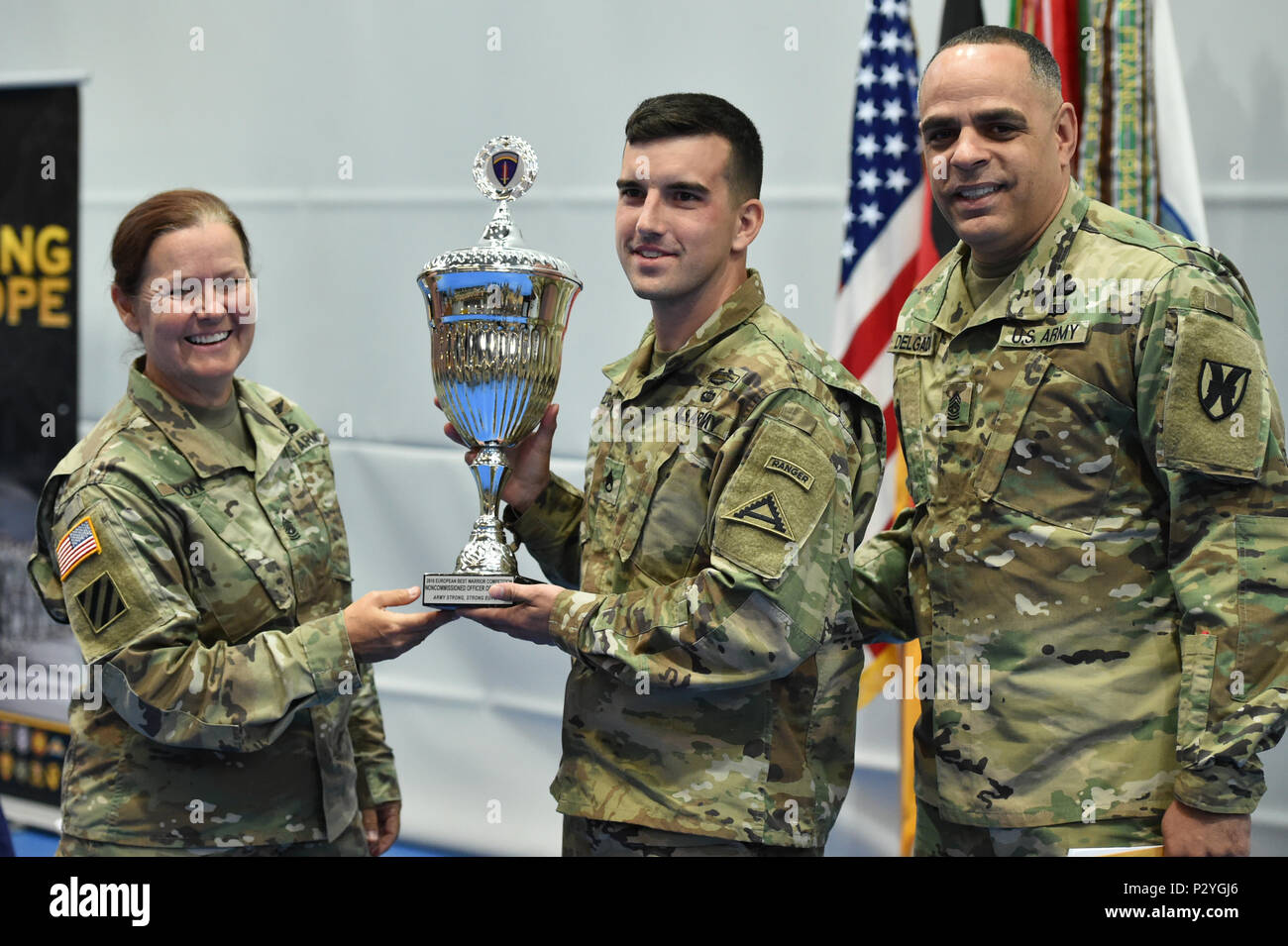 GRAFENWOEHR, Germany - Staff Sgt. Ethan Rodgers (center) of the 7th Army Training Command, the ...