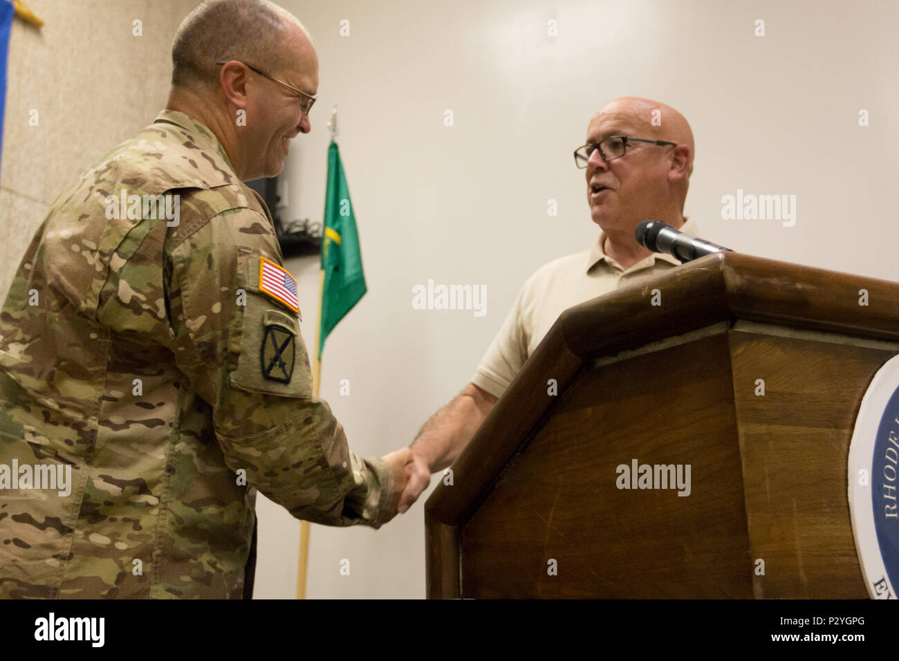Command Sgt. Maj. (Ret.) Thomas Rezendes awards his coin to Command Sgt ...