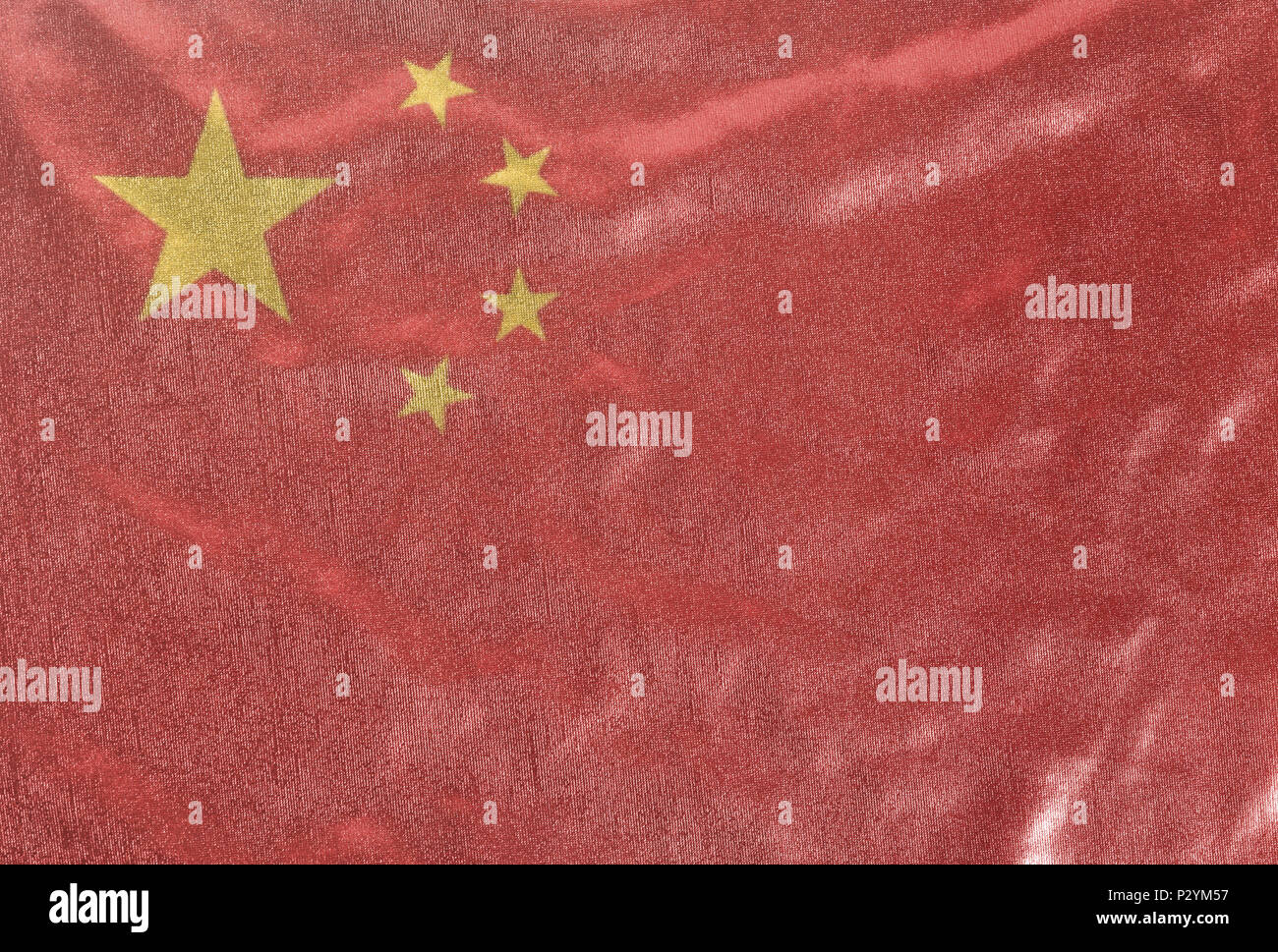 China flag on fabric background texture close up Stock Photo - Alamy