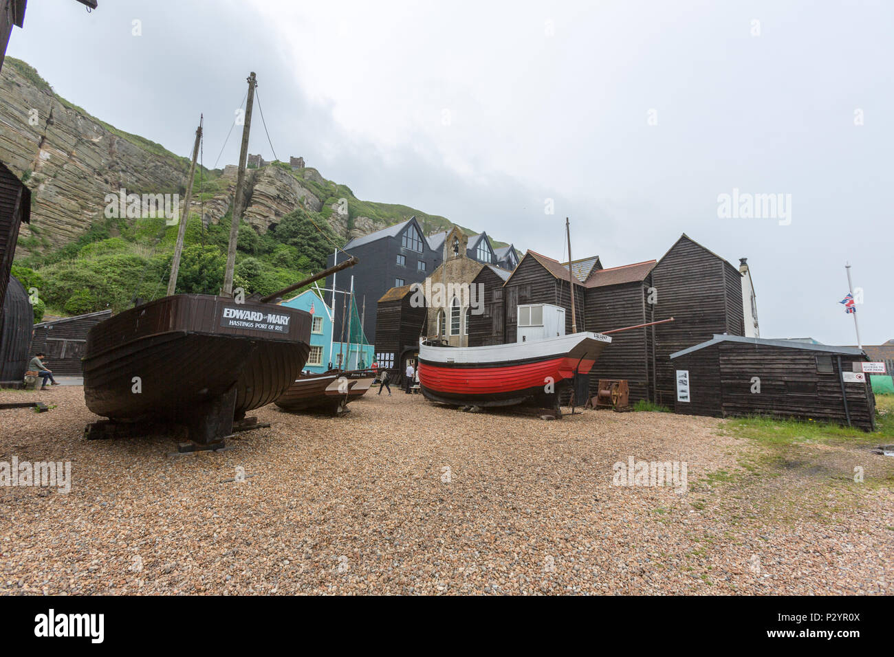 Fishing boats with the Hastings Net Shops, Fisherman black wooden huts ...
