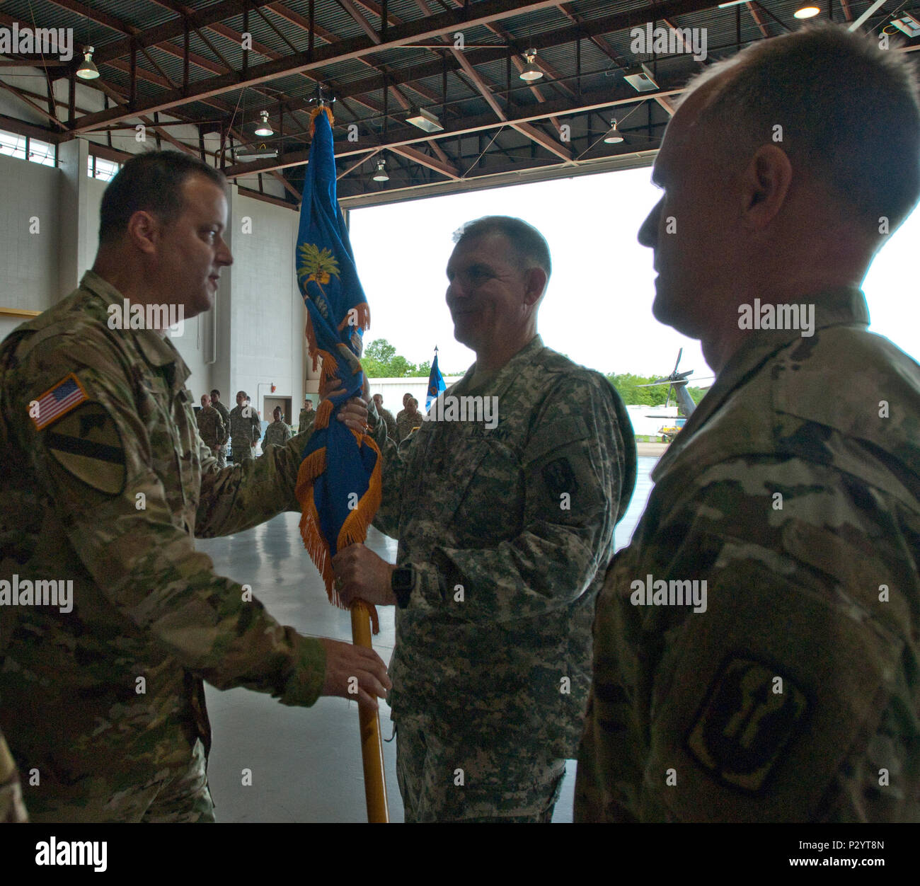 Lt. Col Andrew S. Rendon (left) accepts the colors of the 1st Battalion ...