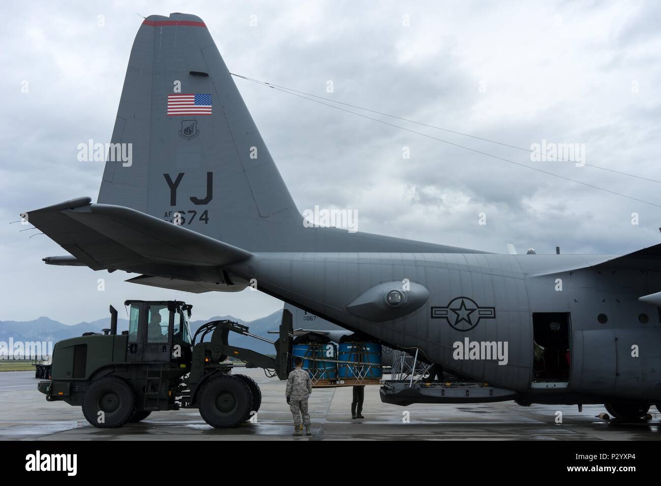 A 10k all-terrain forklift loads container delivery system bundles onto ...