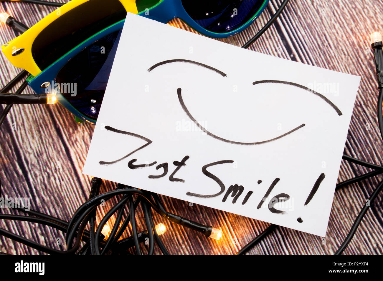 Expression of Just Smile is given in picture. Glasses with two specific ...