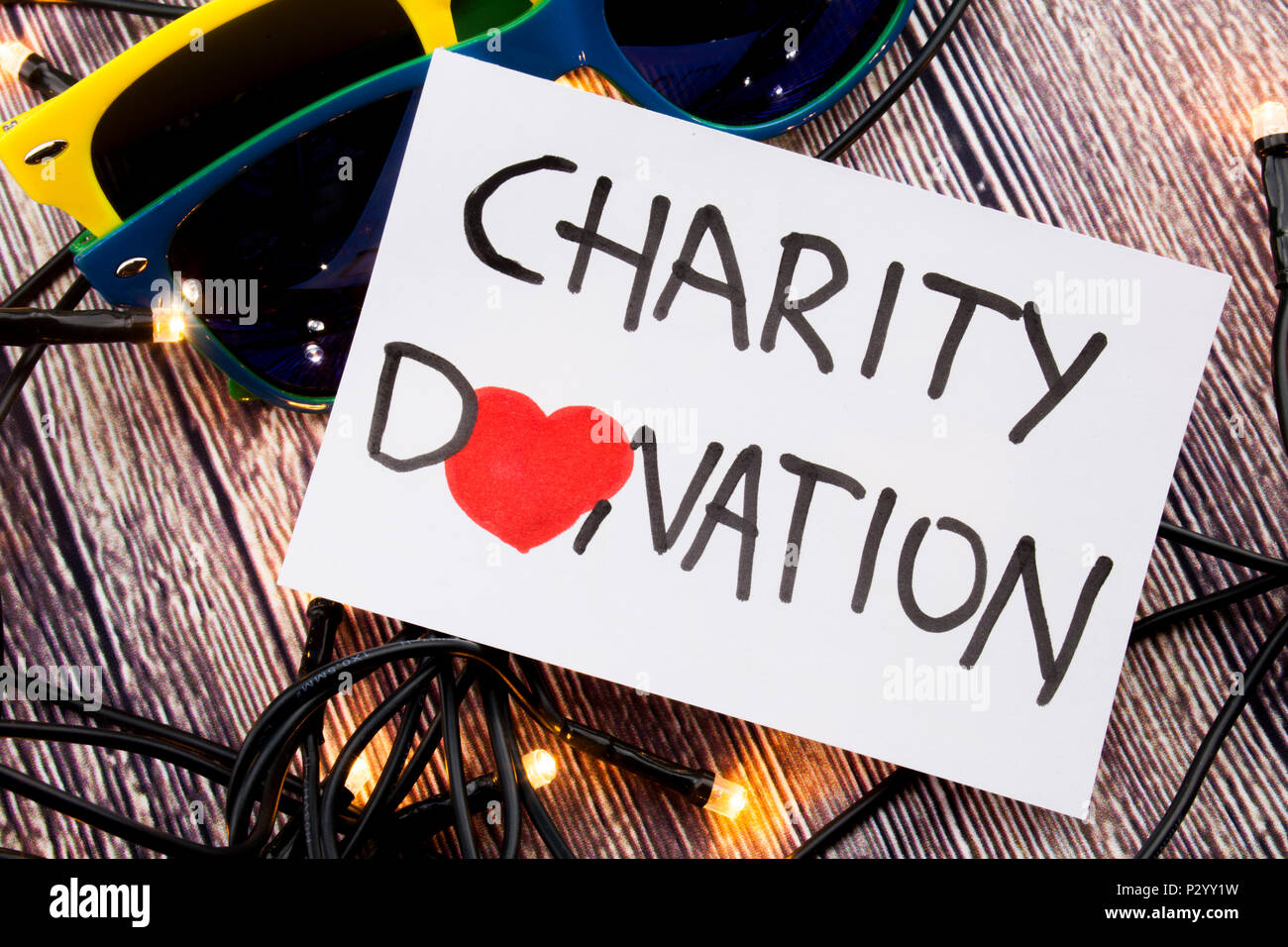 Conceptual image with Charity Donations handwritten text on notepaper ...