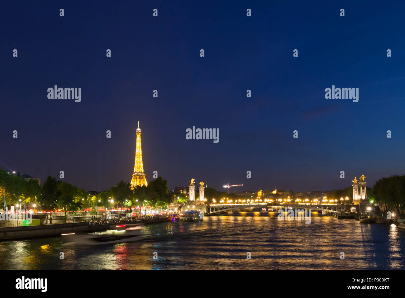 Paris at night with the Eiffel tower illuminated Stock Photo - Alamy