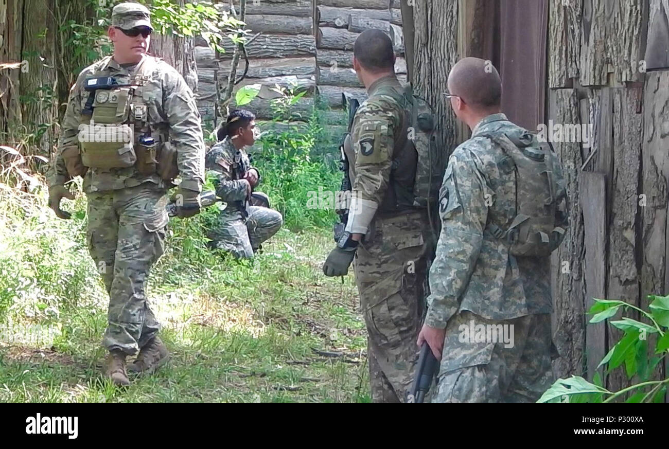 (Left) An observer coach/trainer with Army National Guard Operations ...