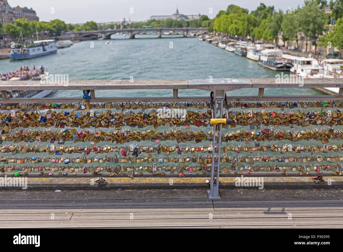 Bridge across river Seine with locks in Paris France Stock Photo - Alamy