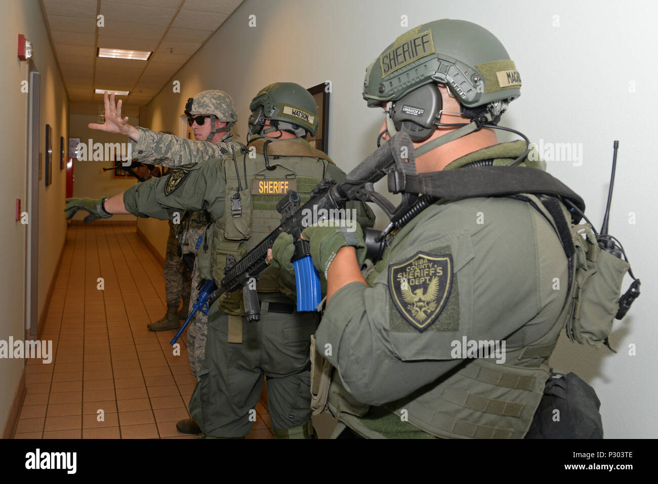 A 9th Security Forces Squadron member briefs a Yuba County Sheriff's ...