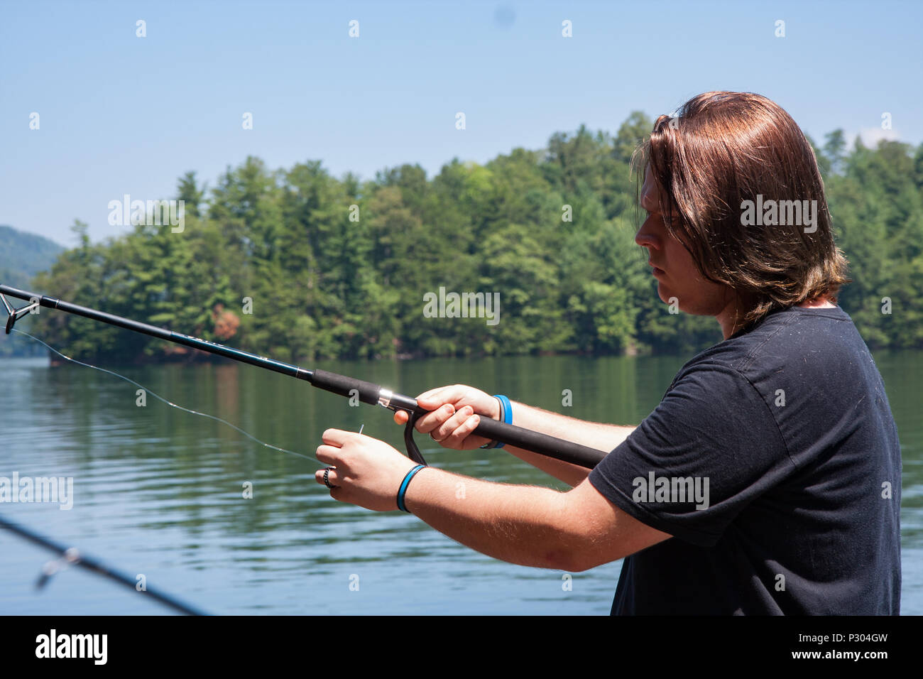 Fishing at the lake Stock Photo - Alamy