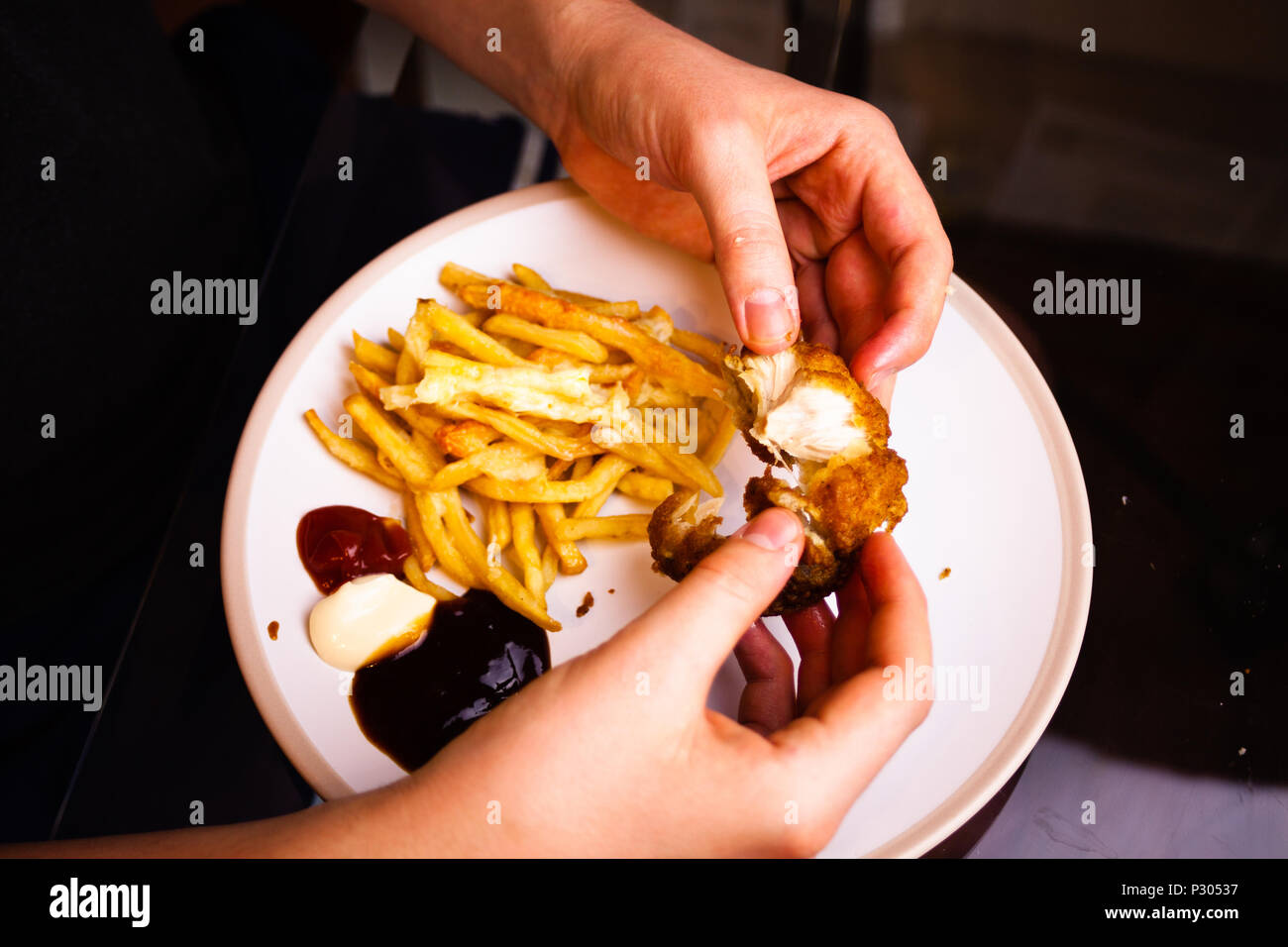 Man eating chicken wings hi-res stock photography and images - Alamy