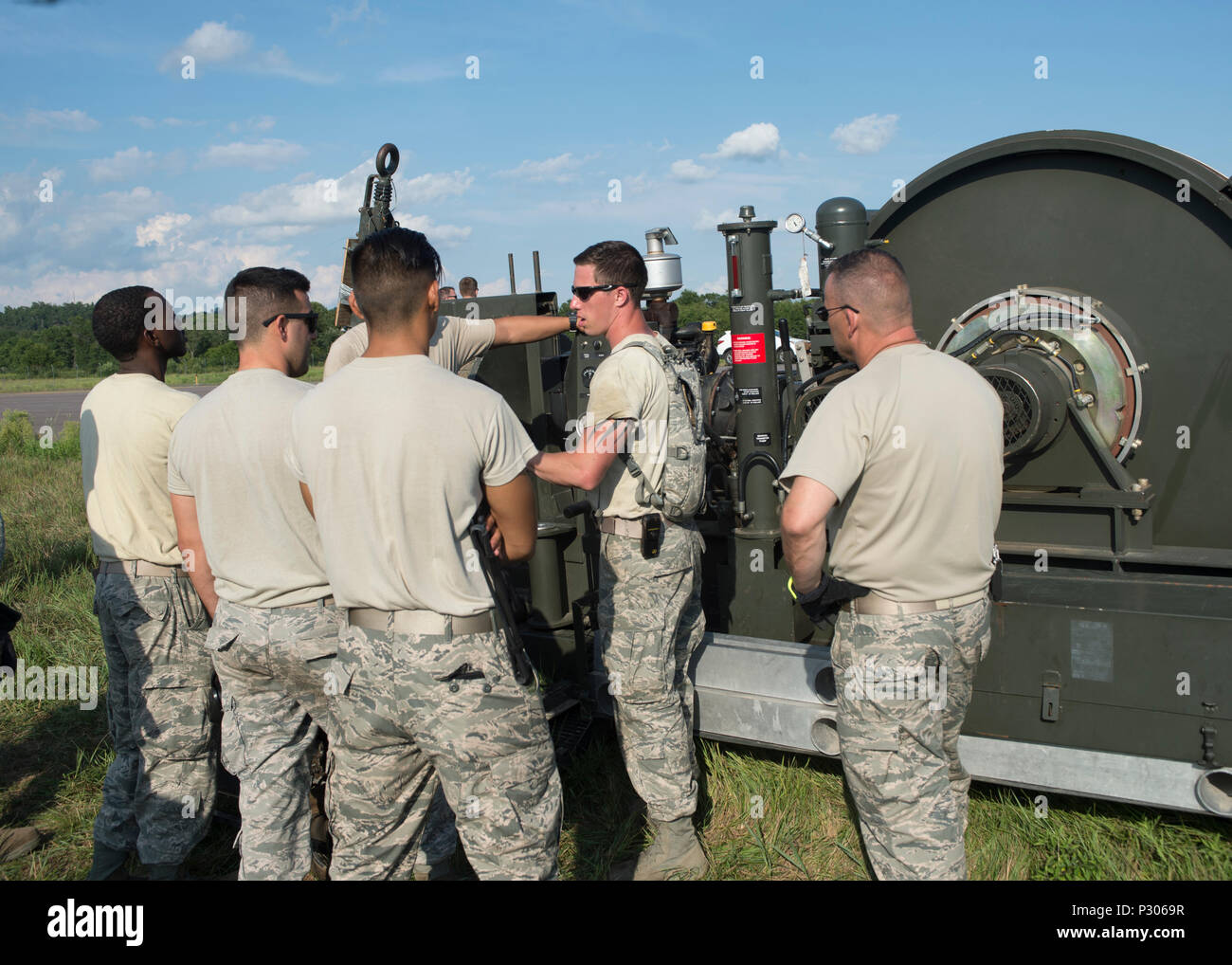 Staff Sgt. Daniel Narlock (center), 446th Civil Engineer Squadron ...