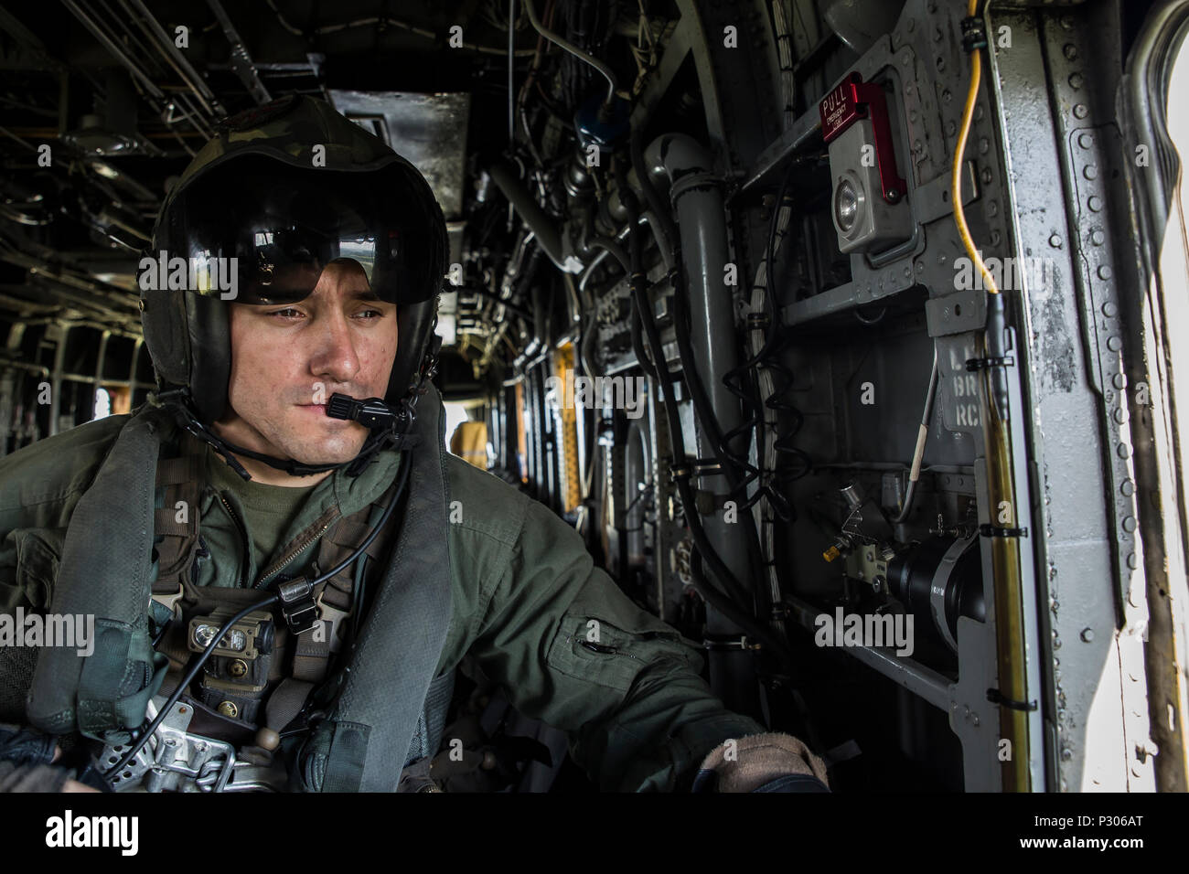 A Marine rides aboard CH-53E Super Stallion during Exercise Arrowhead ...