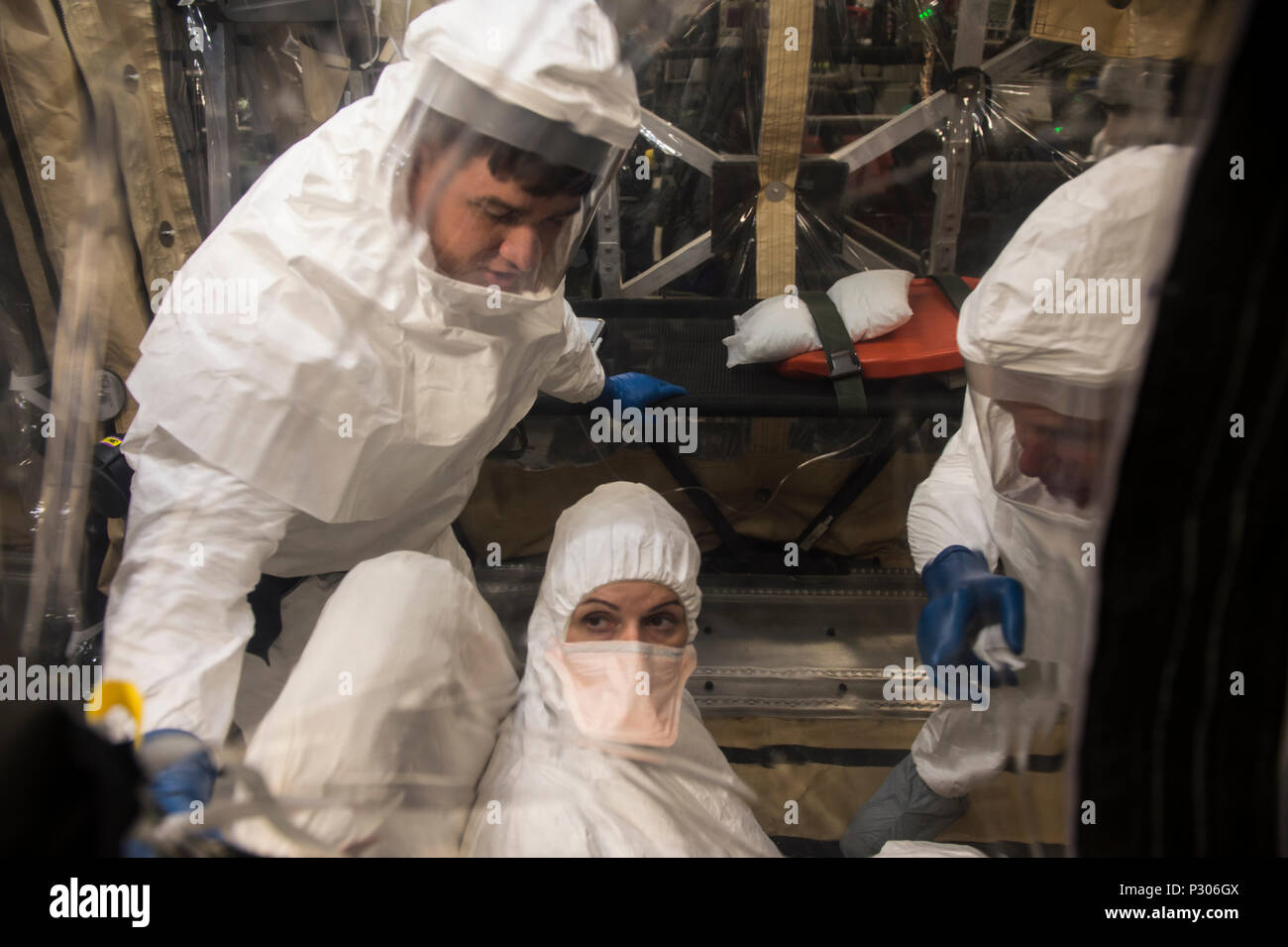 Aeromedical evacuation team members enter the Transport Isolation ...