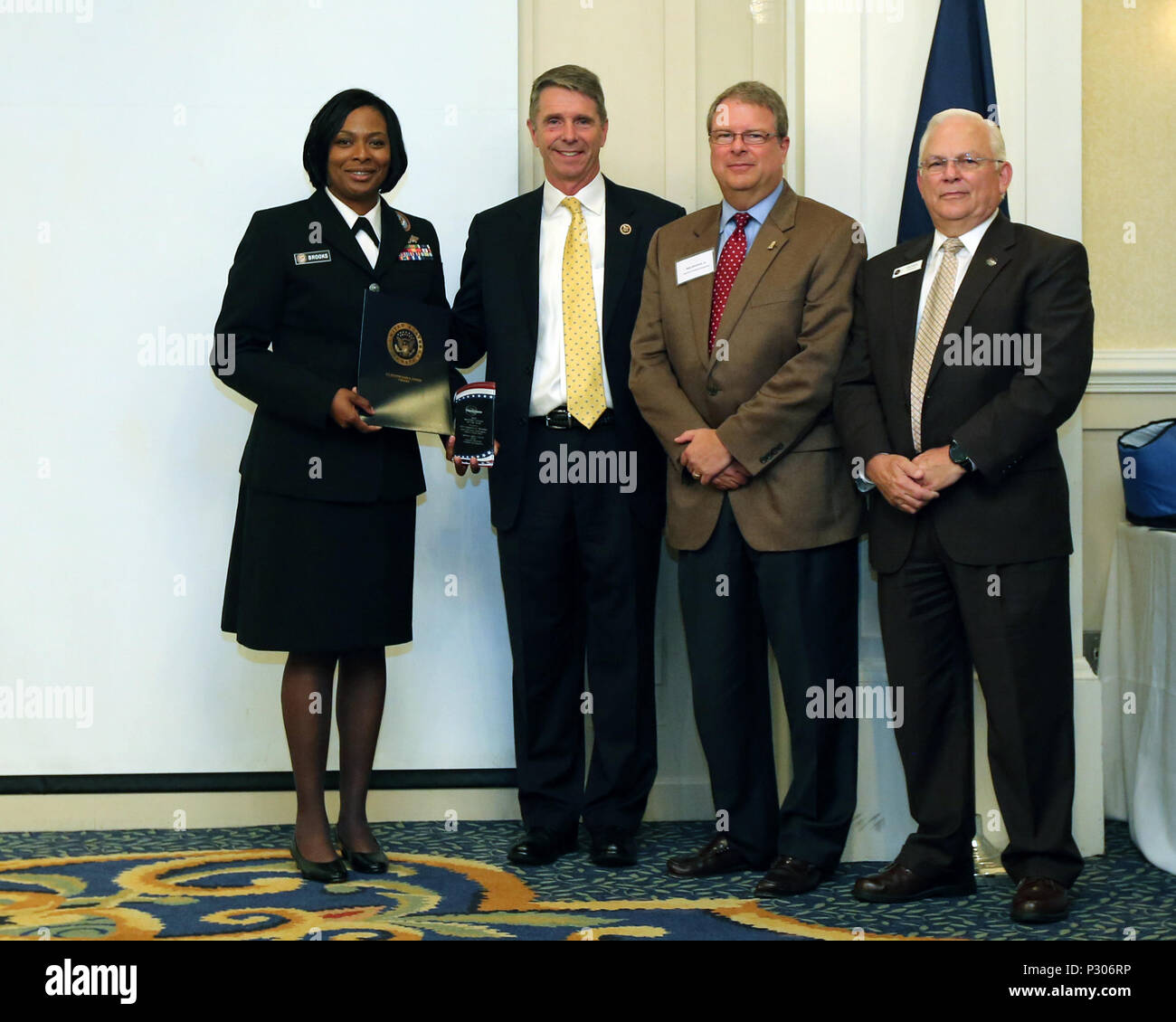 U.S. Navy Logistics Specialist 1st Class S. Laquita Brooks accepts the ...